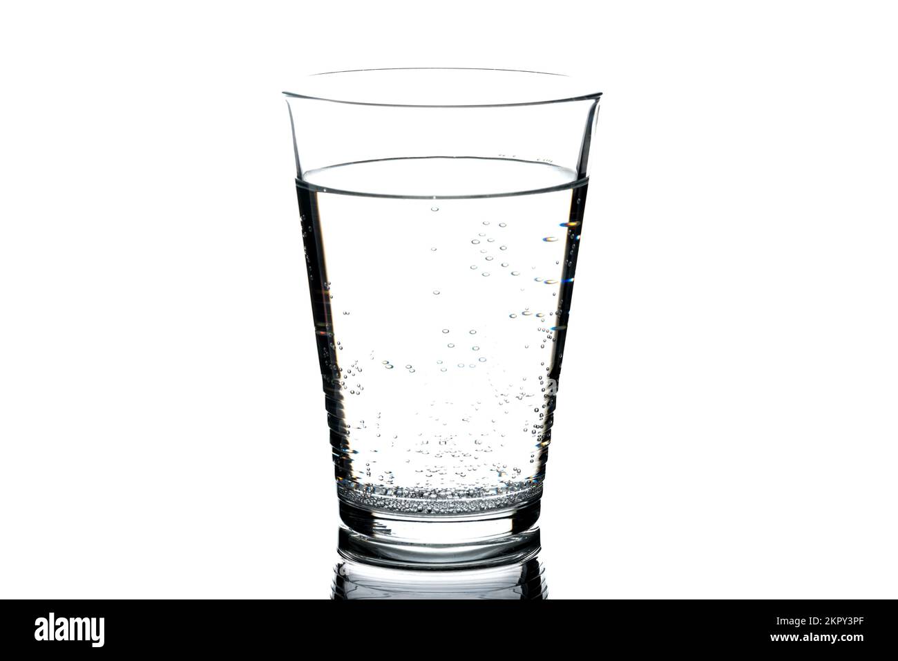 Glass of drink water with gas on white background Stock Photo - Alamy
