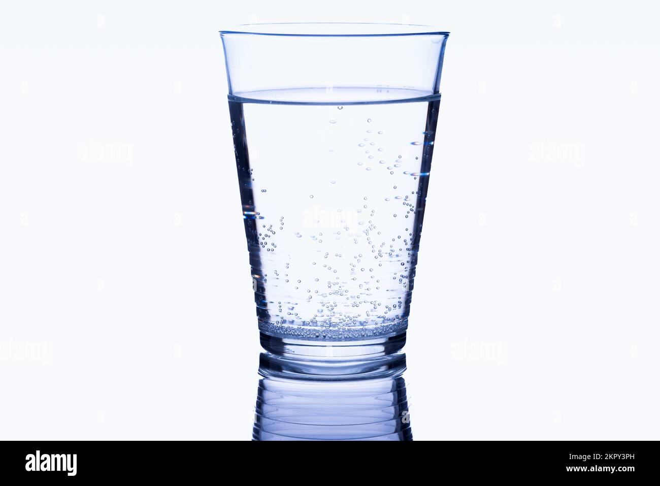 Glass of drink water with gas on white background Stock Photo - Alamy
