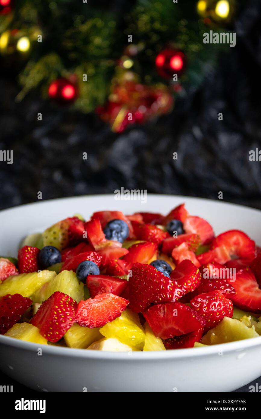 Fruit dessert with chocolate and cream topping in the bowl, Christmas ...