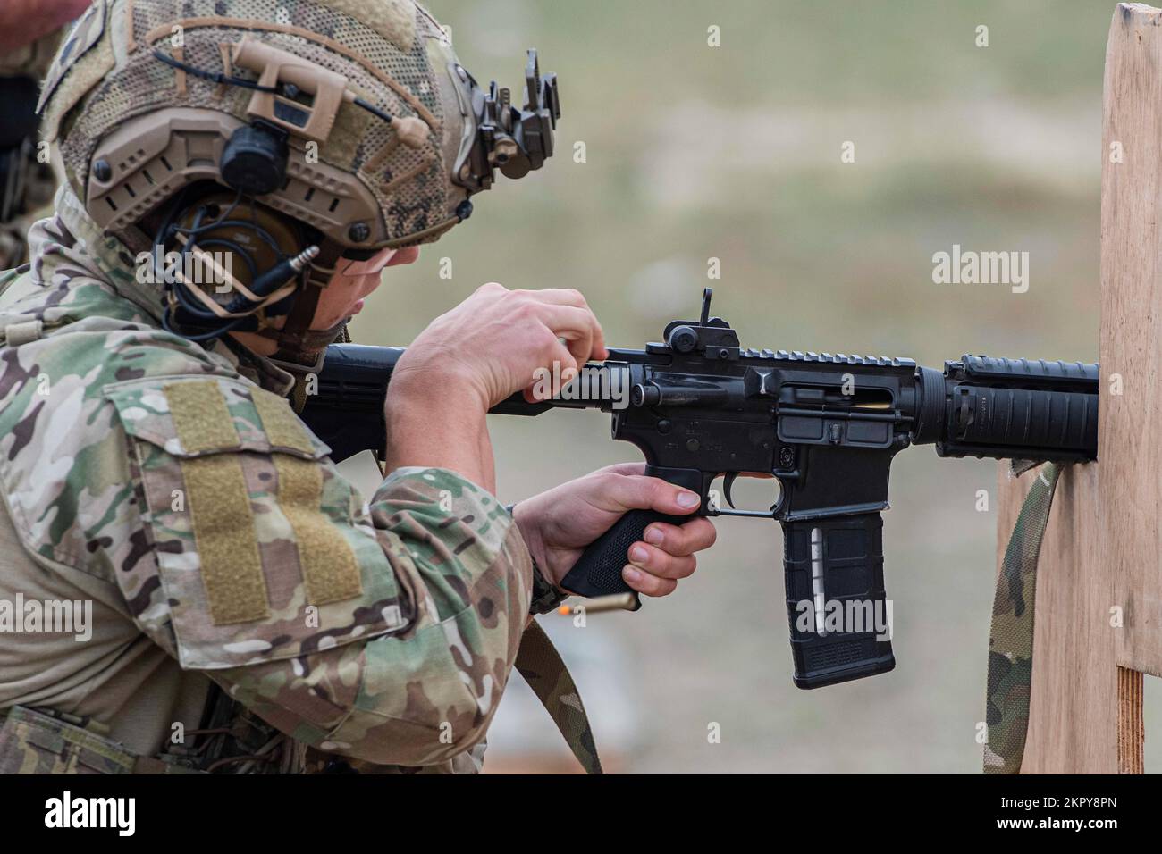 A U.S. Air Force Tactical Air Control Party (TACP) specialist fires his ...