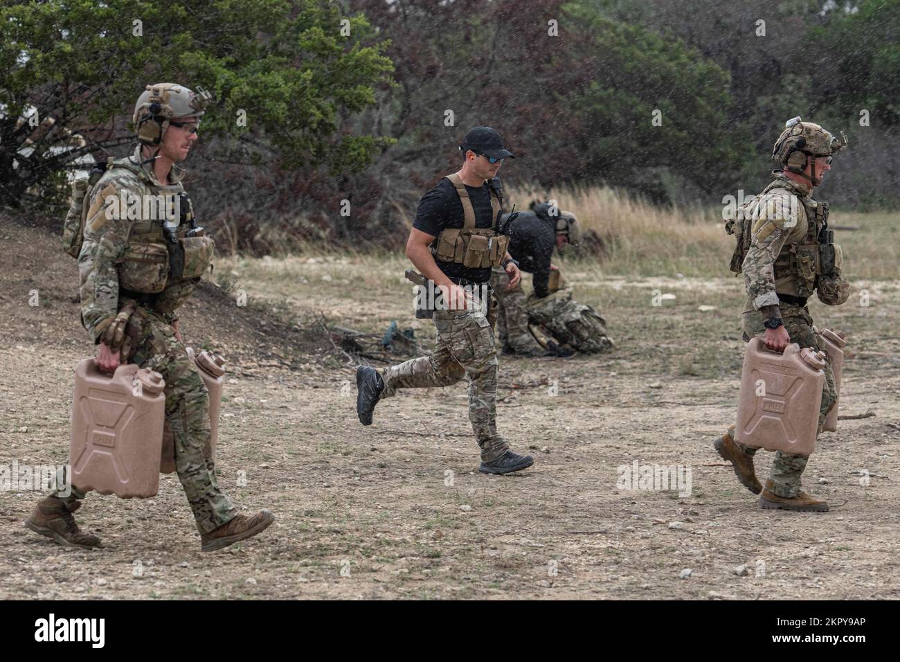 Two U.S. Air Force Tactical Air Control Party (TACP) specialist carry ...