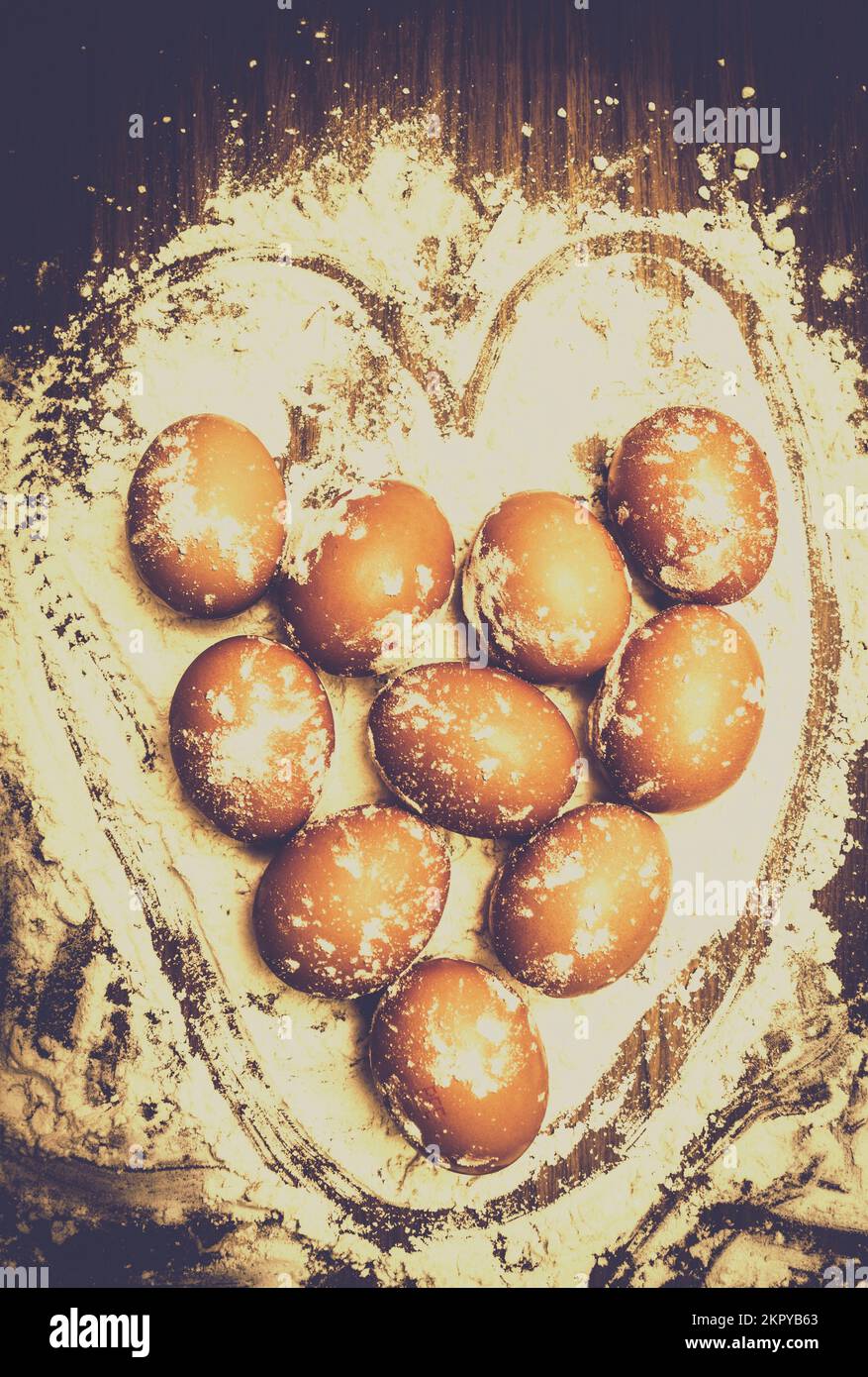 Retro kitchen bench art of a mixup of eggs and flour in heart shape ...