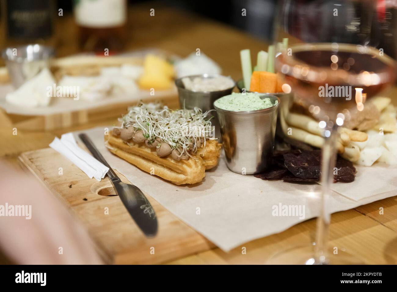 Meeting friends in a restaurant or cafe with wine and snacks Stock ...