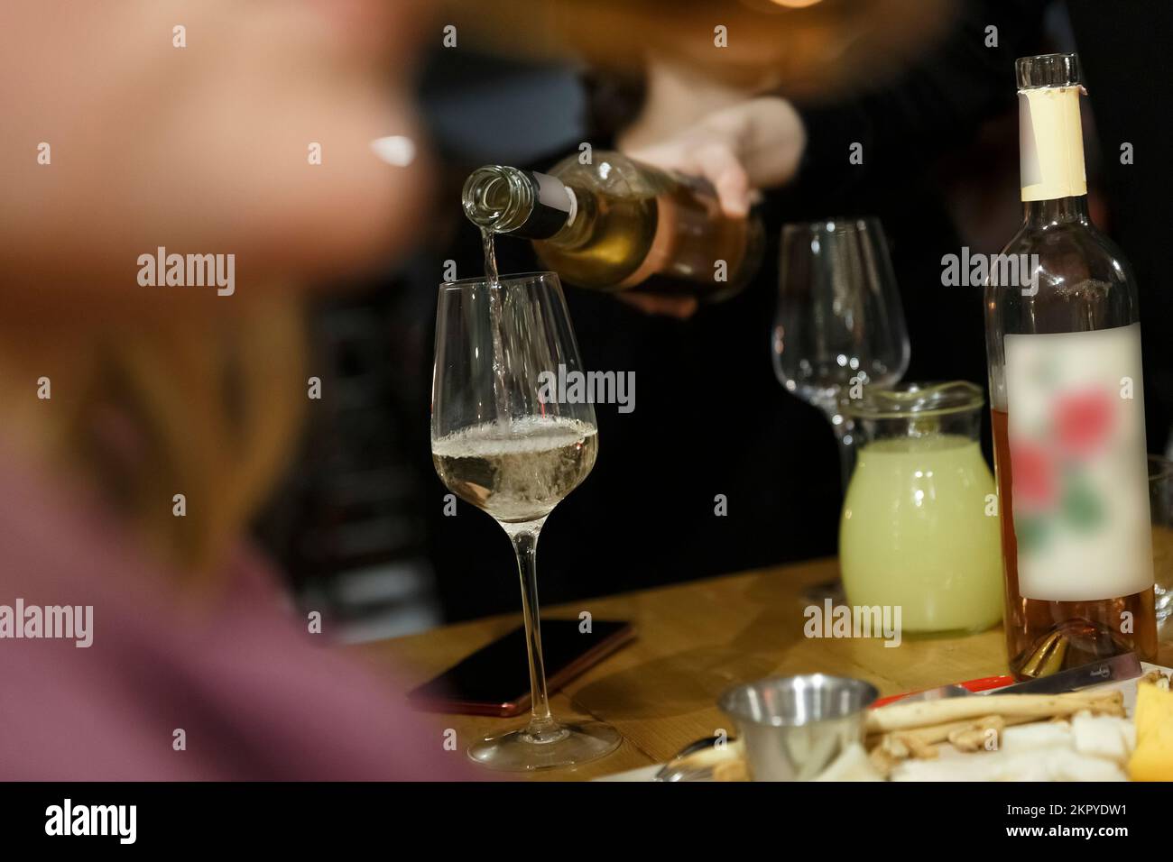 Meeting friends in a restaurant or cafe with wine and snacks Stock ...