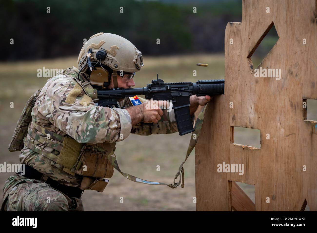 A Tactical Air Control Party Airman fires at a target during Lightning ...