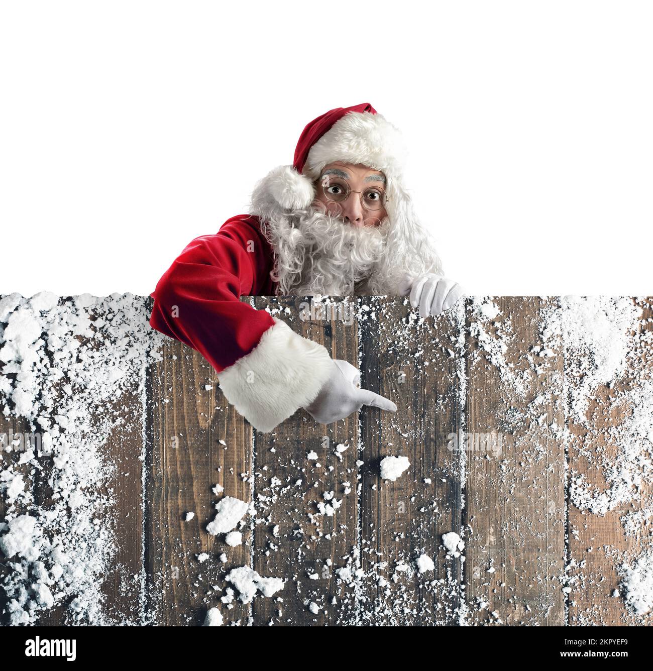 Santa claus indicate something with hand in a wooden wall Stock Photo ...