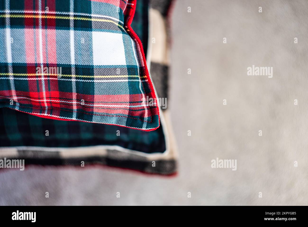 Close-up of a stack of assorted pillows with various checked patterns ...