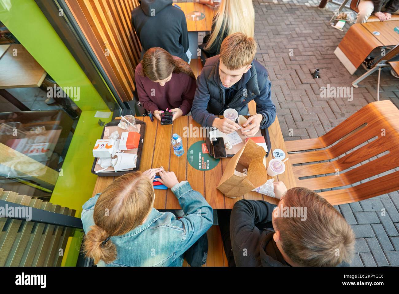 KALININGRAD, RUSSIA - CIRCA JULY, 2022: people eat at fast food ...