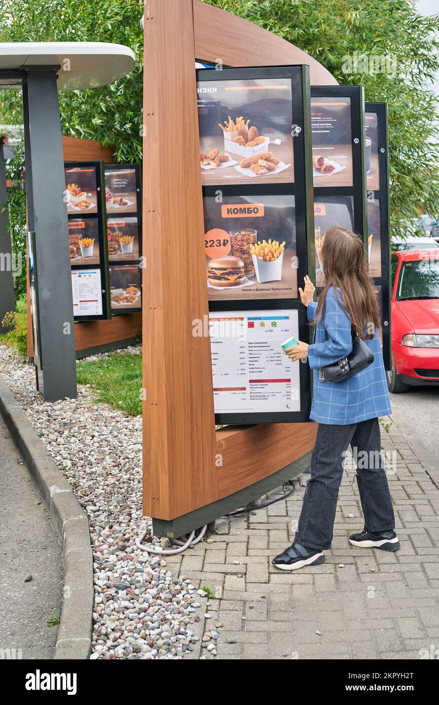 KALININGRAD, RUSSIA - CIRCA JULY, 2022: teenager with paper cup from ...