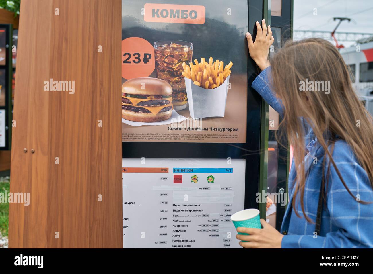 KALININGRAD, RUSSIA - CIRCA JULY, 2022: teenager with paper cup from ...