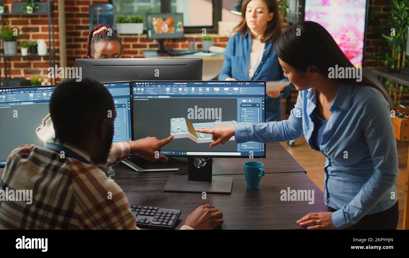 Professional agency workers designing industrial prototype on creative ...