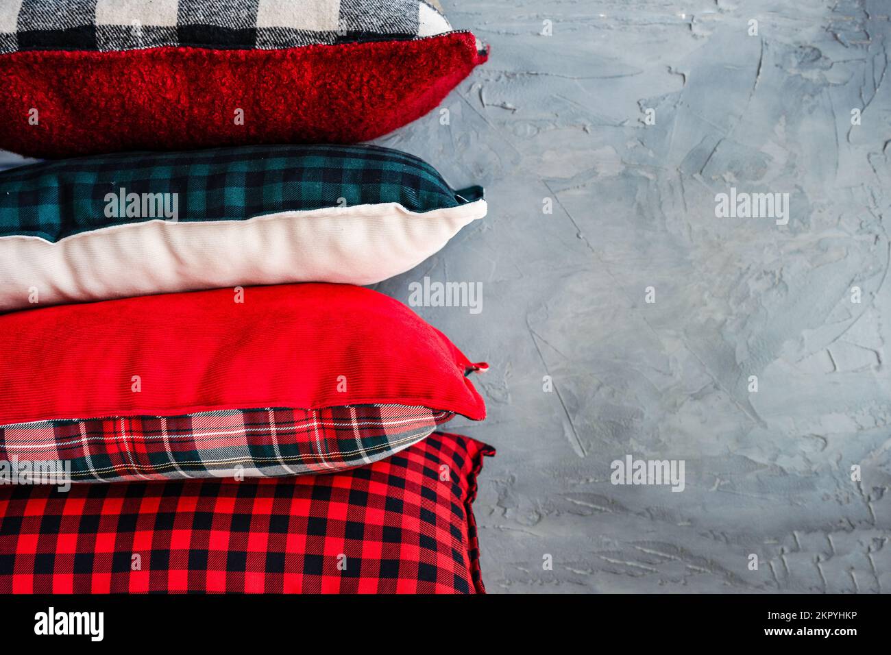 Close-up of a stack of assorted pillows with various checked patterns ...