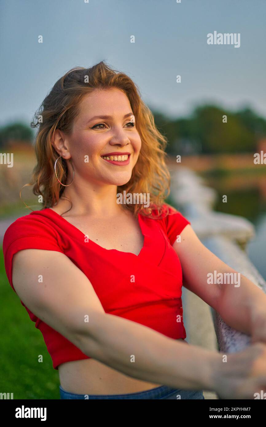 Outdoor portrait of young smiling woman in Kaliningrad Stock Photo - Alamy