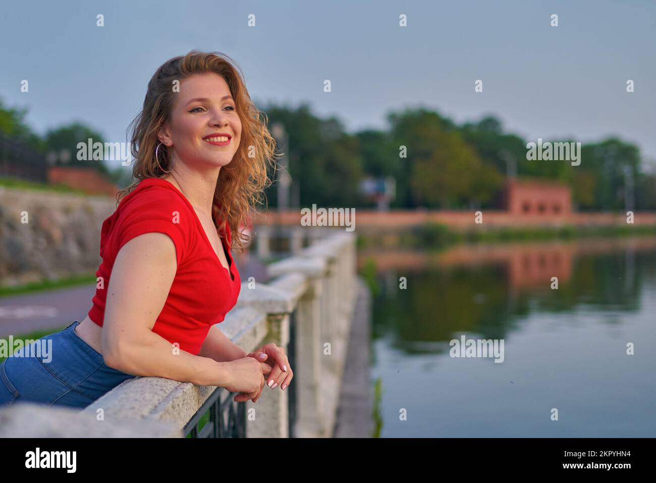 Outdoor portrait of young smiling woman in Kaliningrad Stock Photo - Alamy