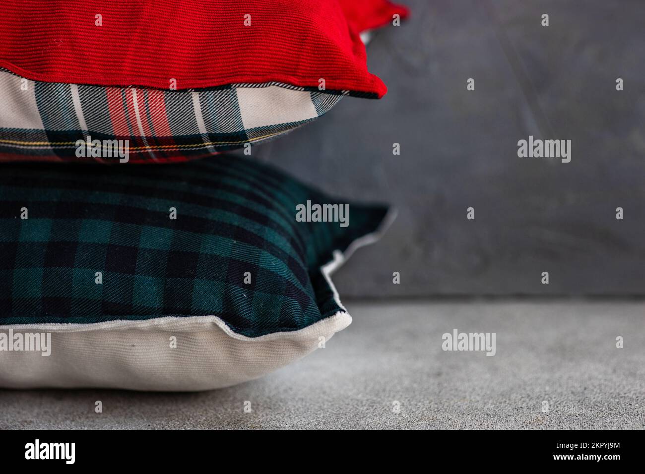 Close-up of a stack of assorted pillows with various checked patterns ...