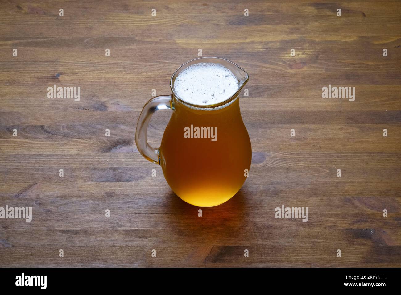 Full pitcher of beer close up on wooden table with copy space Stock ...