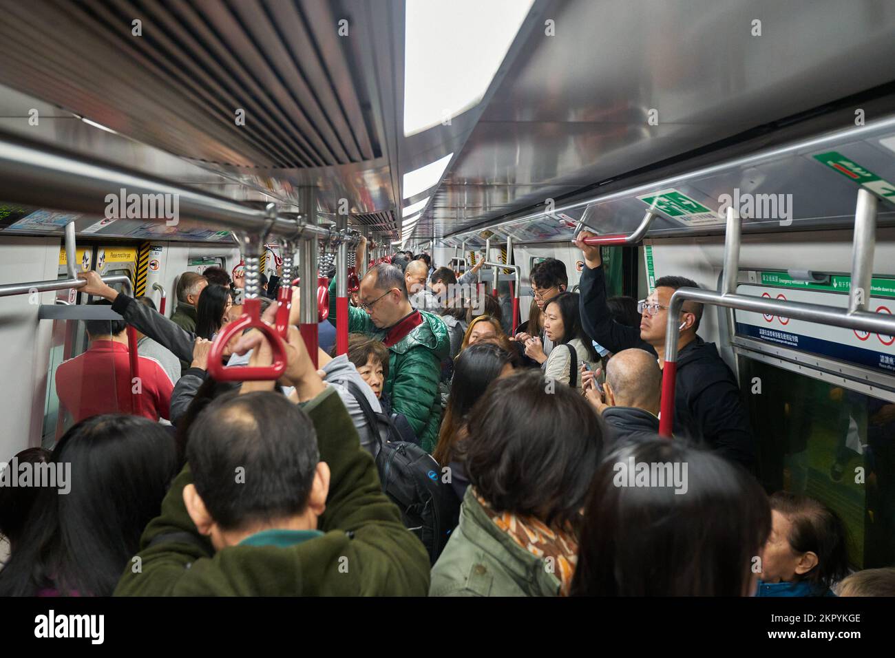 HONG KONG - CIRCA DECEMBER, 2019: commuters inside a MTR train in Hong ...