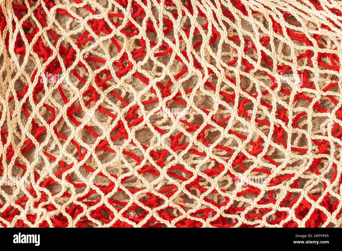 Natural background of mesh string reusable knitted bags closeup, two ...