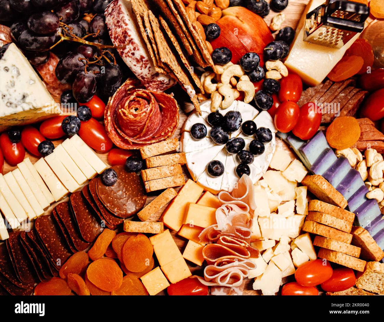 Cheese platter, cheese board meat and board. Vegetables and fruits with ...