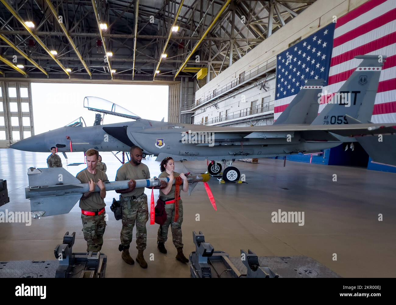 A 96th Aircraft Maintenance Squadron Red team carry an AIM-9 during the ...