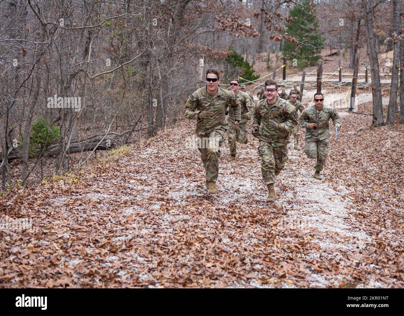 Cadets from Wheaton College's nine-person team, run toward the next ...