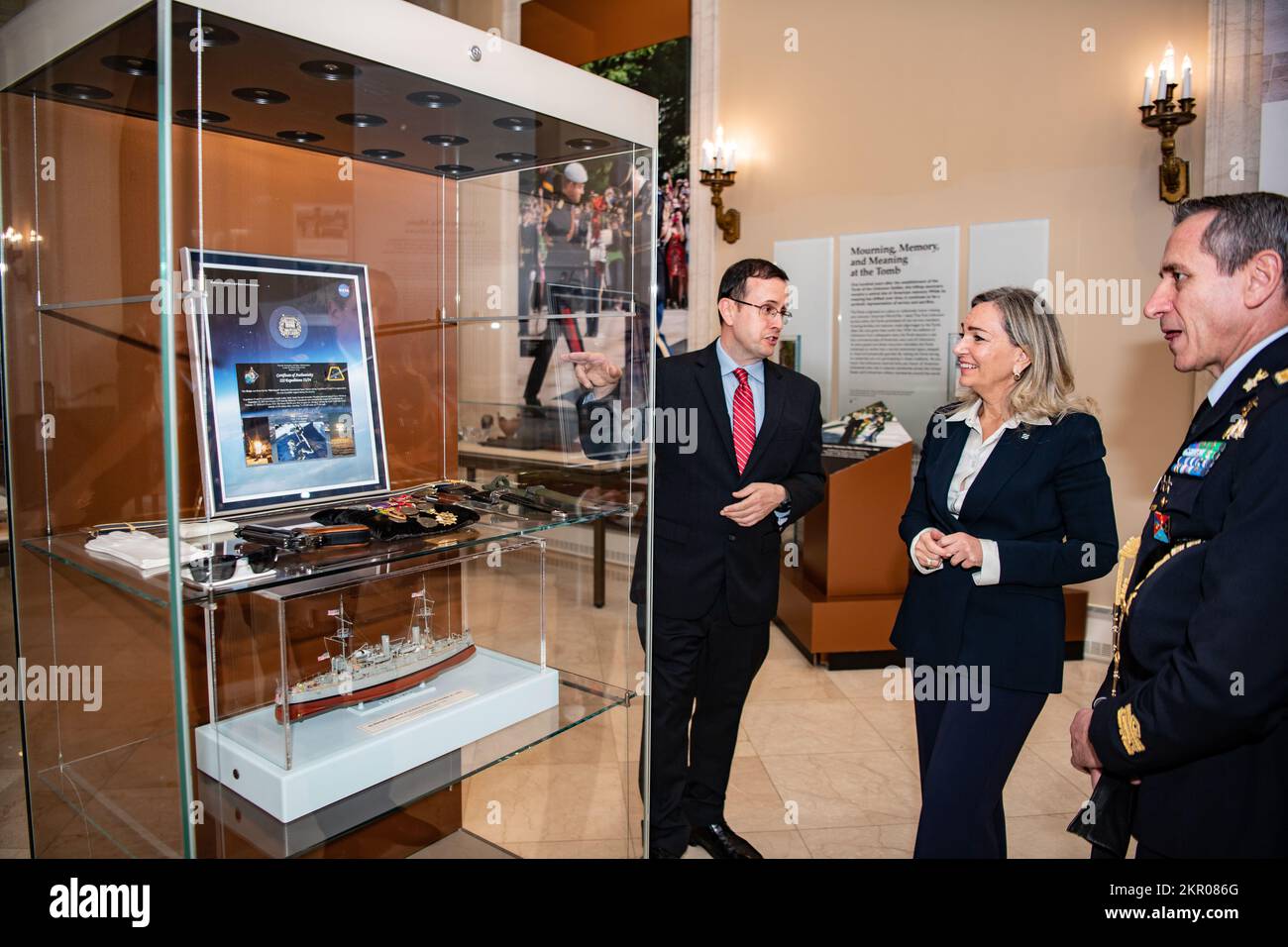 Tim Frank (left), historian, Arlington National Cemetery, gives a tour ...