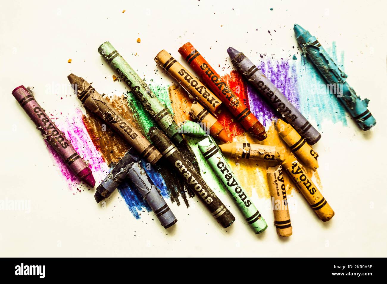 Contemporary studio art scene of colorful crayons, flaked peeled and ...