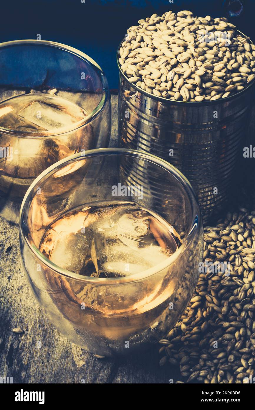 Rustic blue malted whisky in a still of aged seeds and hard tumblers ...