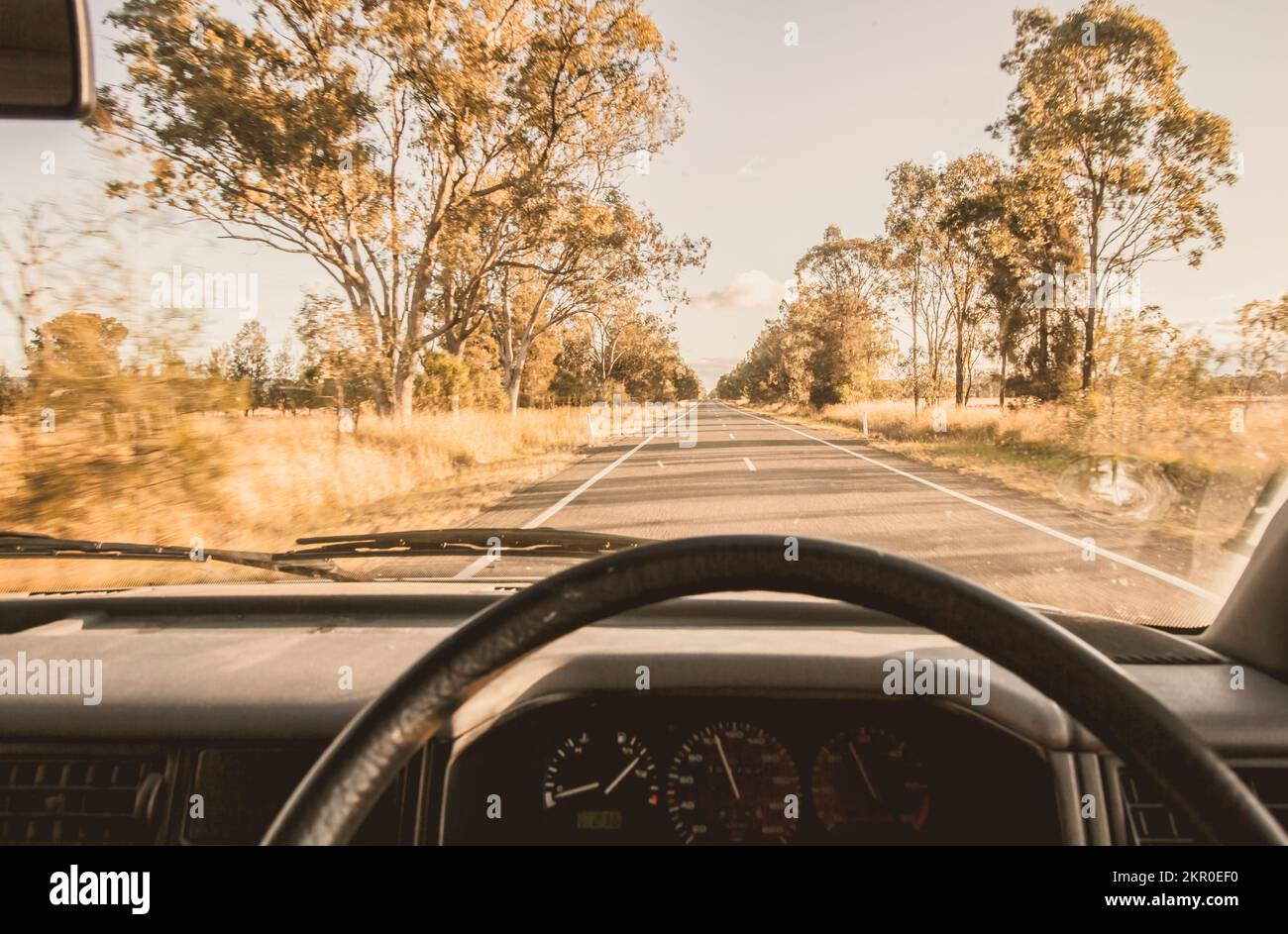 First person dashboard pov of driving a car on a rural Australian road ...
