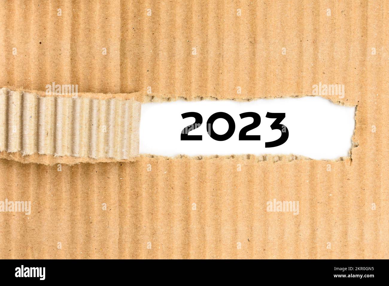 The year 2023 on torn paper, background for office supplies Stock Photo ...