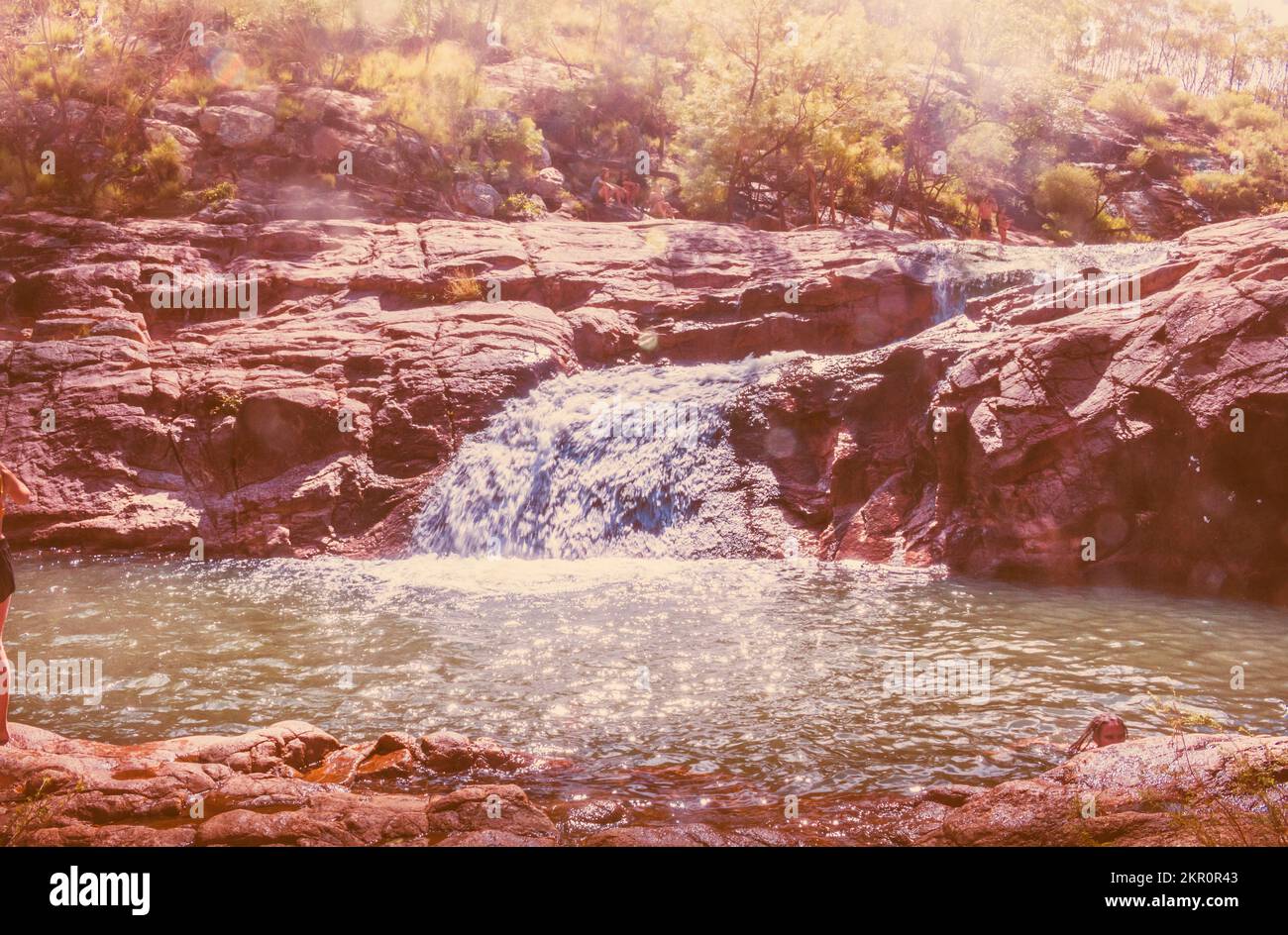 Sun flared water rush with harmonious waterfall showcased in dreamtime ...