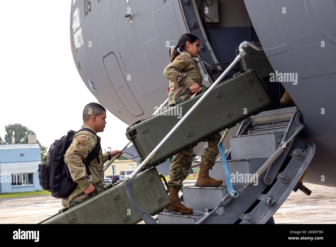 U.S. Airmen with the 156th Wing, Puerto Rico Air National Guard, board ...