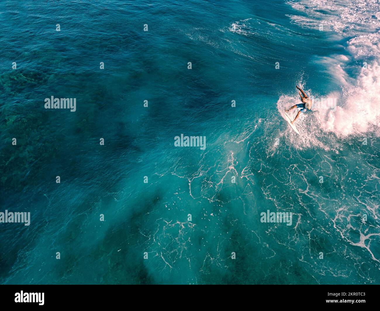 Aerial view of surfer on a wave Stock Photo - Alamy