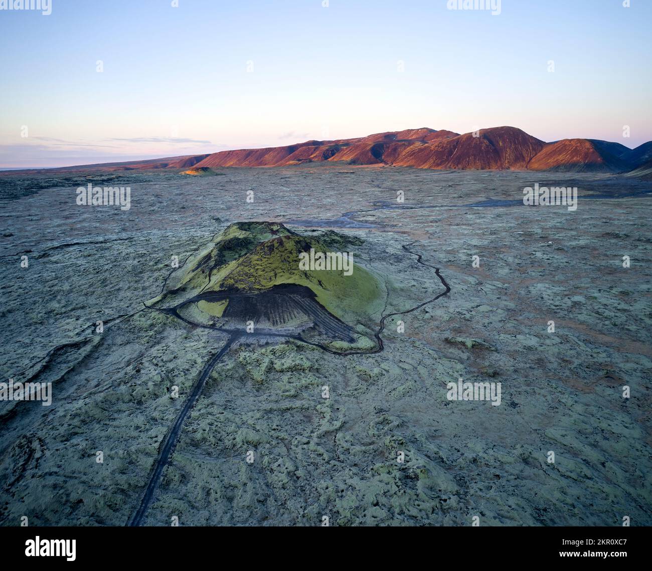 Amazing view of volcano surrounded by asphalt road Stock Photo - Alamy