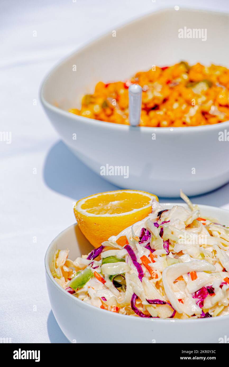 Sunday BBQ Set Coleslaw with Lemon Garnish Stock Photo - Alamy