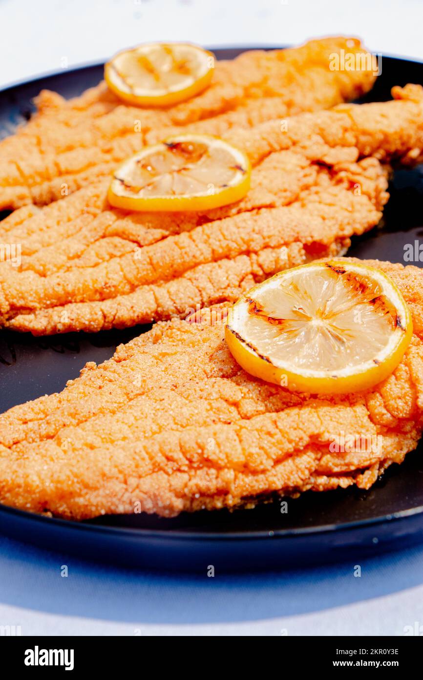 BBQ Set Fried Catfish with Lemon Garnish Stock Photo - Alamy