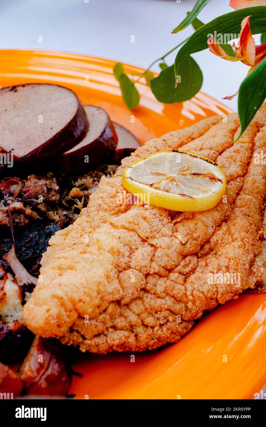 Sunday BBQ Plate-Up with Pan-Crusted Catfish Stock Photo - Alamy