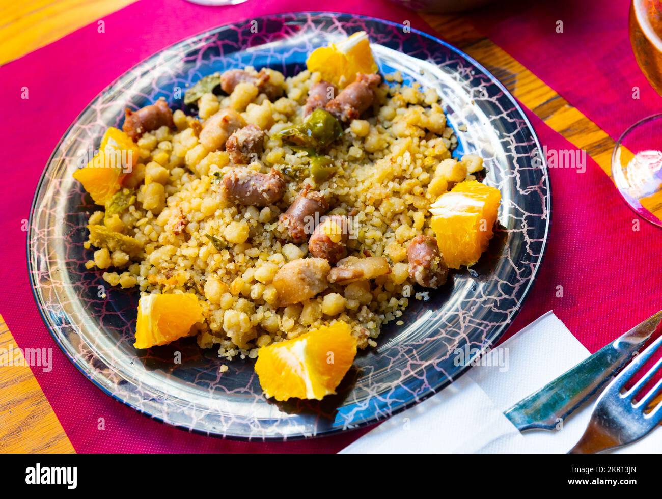 Typical spanish dish from semolina flour with longaliza sausage Stock ...