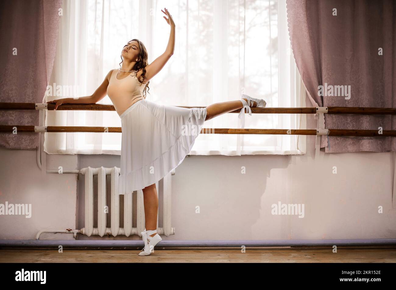Pretty young girl dancer or balerine is dancing in the dancing h Stock ...