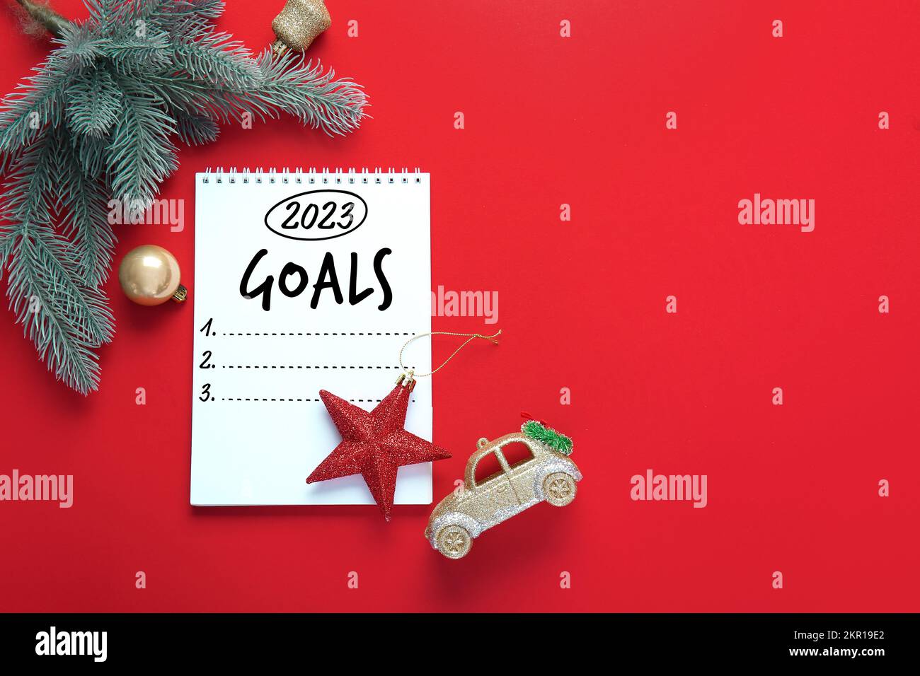 Notebook with blank to-do list for year 2023 and Christmas decor on red ...