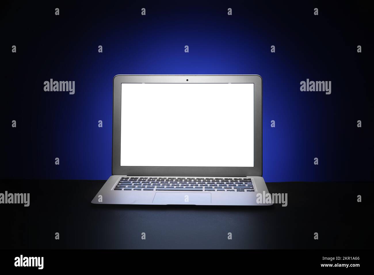 Modern laptop with blank screen on black background Stock Photo - Alamy