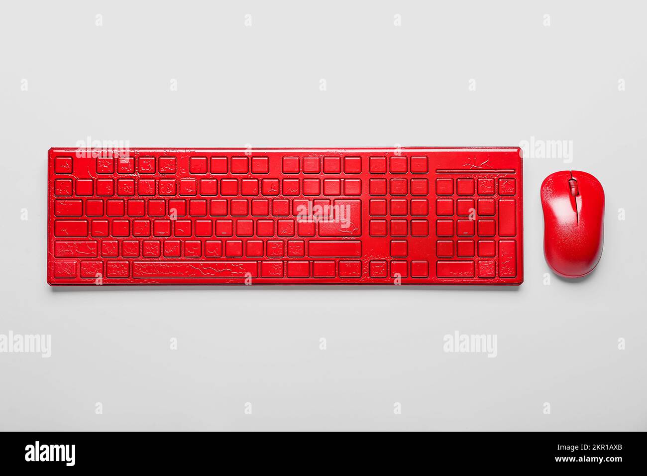 Red computer keyboard and mouse on light background Stock Photo - Alamy