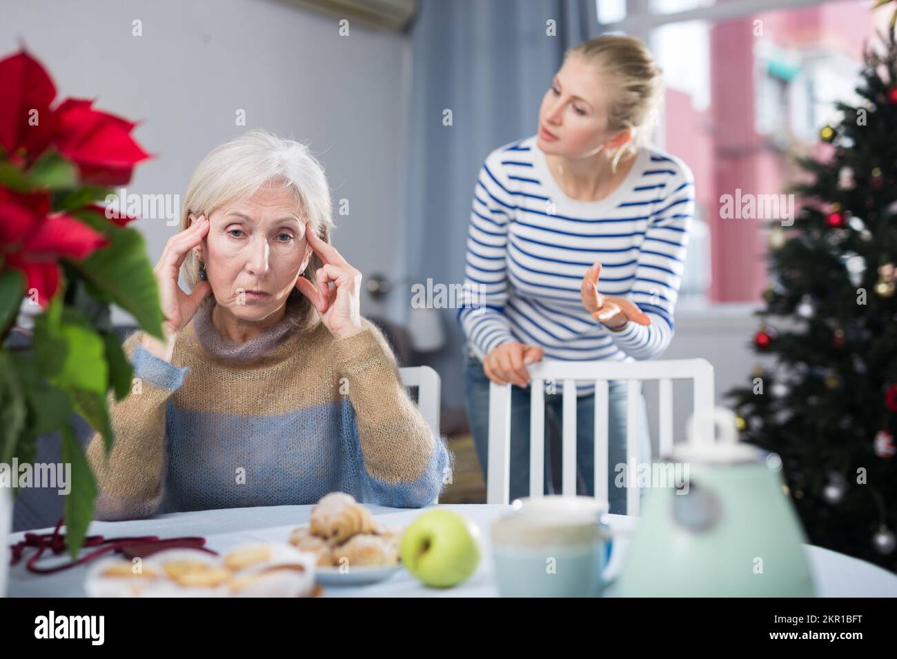 Daughter angry with elderly mother on Christmas night at home Stock ...