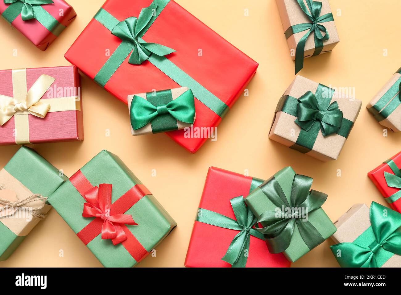 Beautiful Christmas gifts on beige background Stock Photo - Alamy