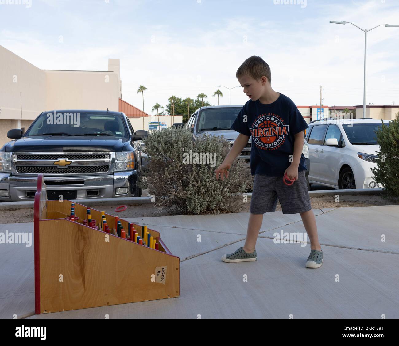 A child participates in a ring toss game during the Marine Corps ...