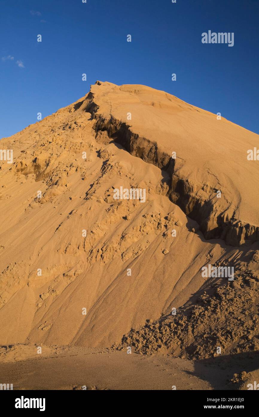 Mound of sand in commercial sandpit Stock Photo - Alamy