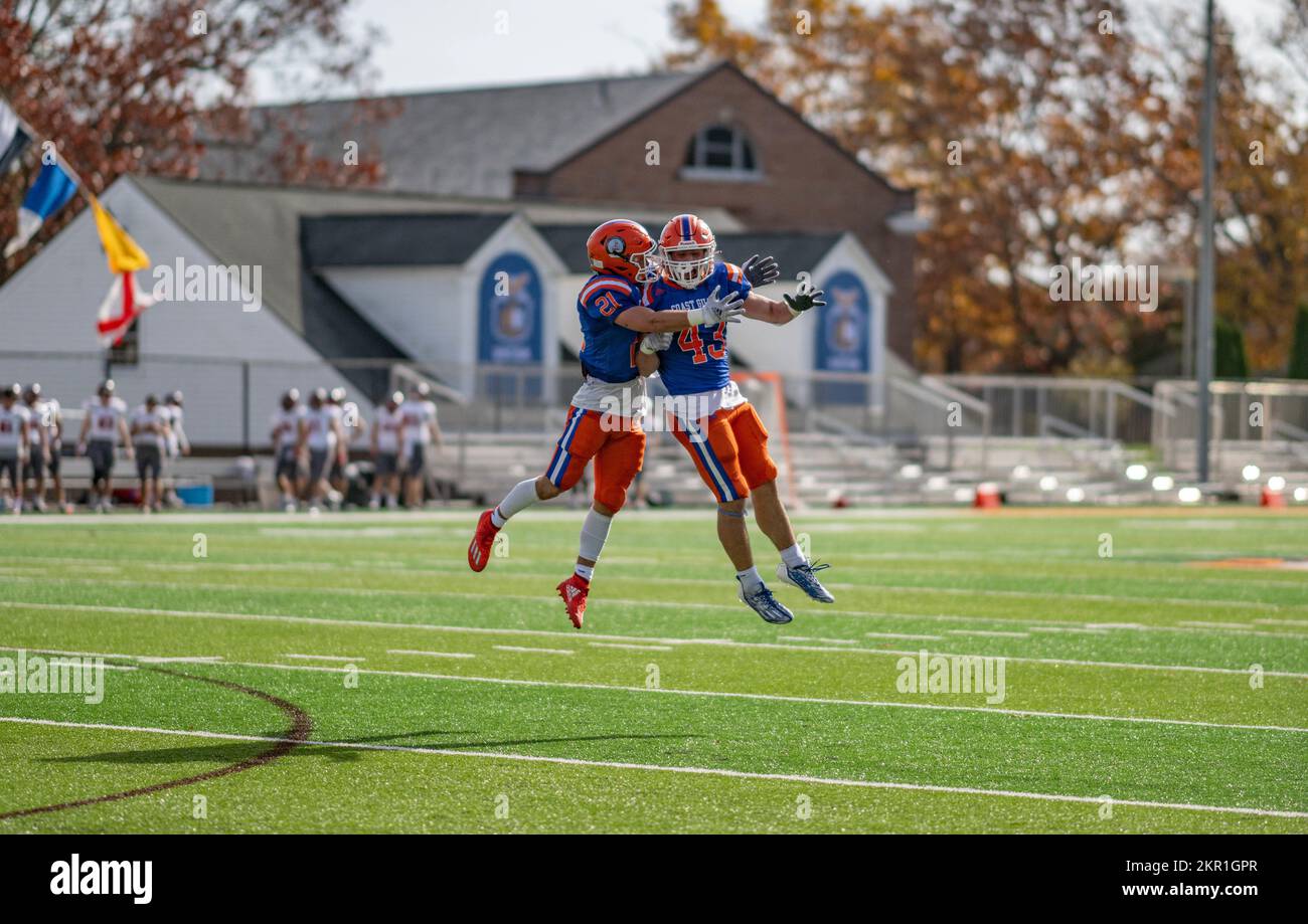 Members of the Coast Guard Academy Bears Football Team celebrate midair ...