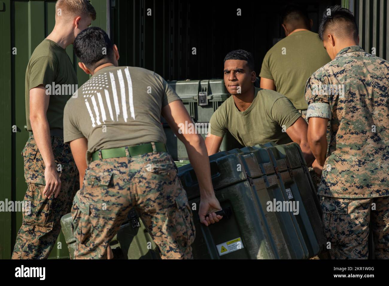 U.S. Marines with Marine Wing Communications Squadron (MWCS) 18 work together to move ...