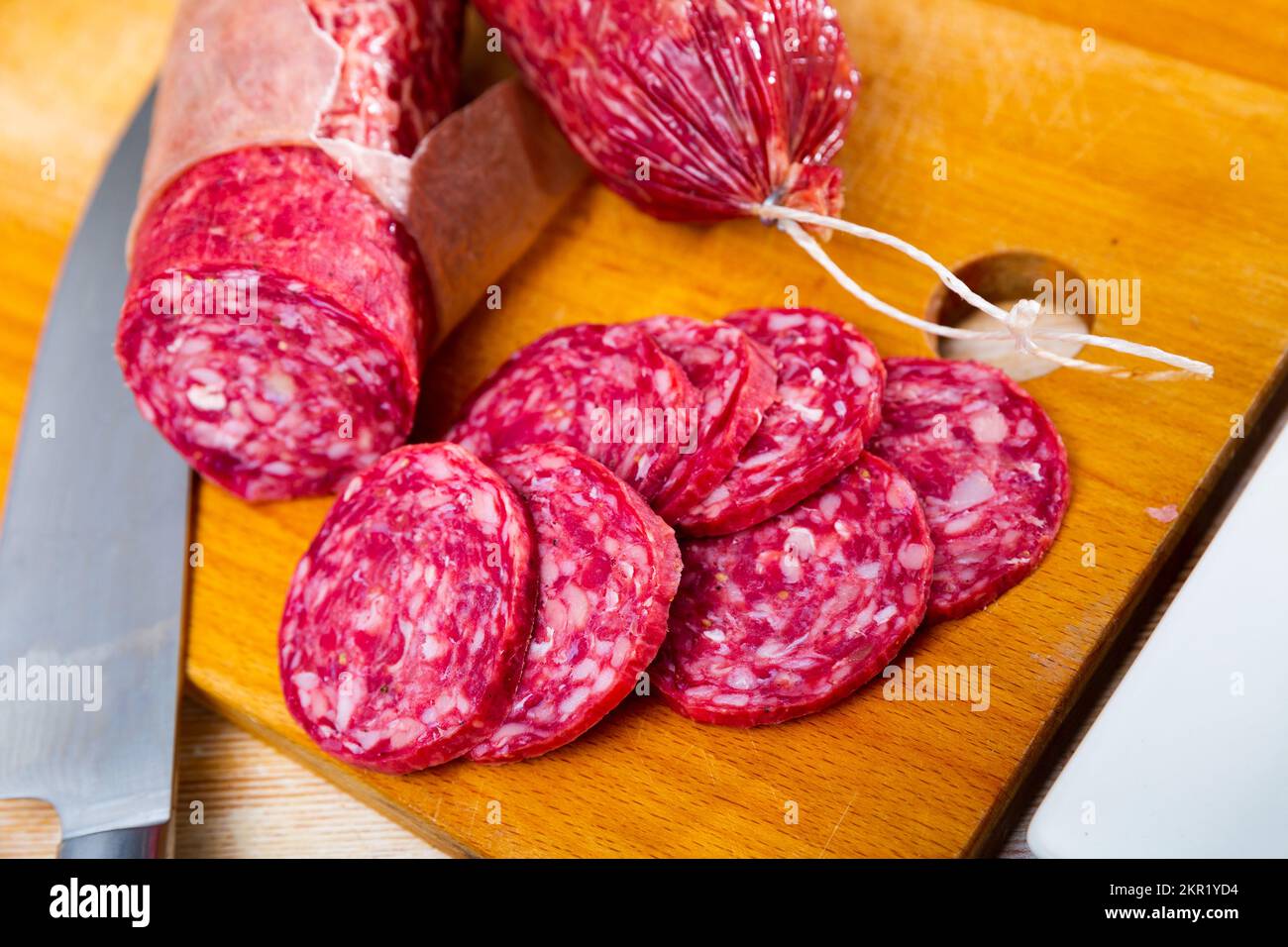 Traditional spanish salchichon sausage on wooden table Stock Photo - Alamy