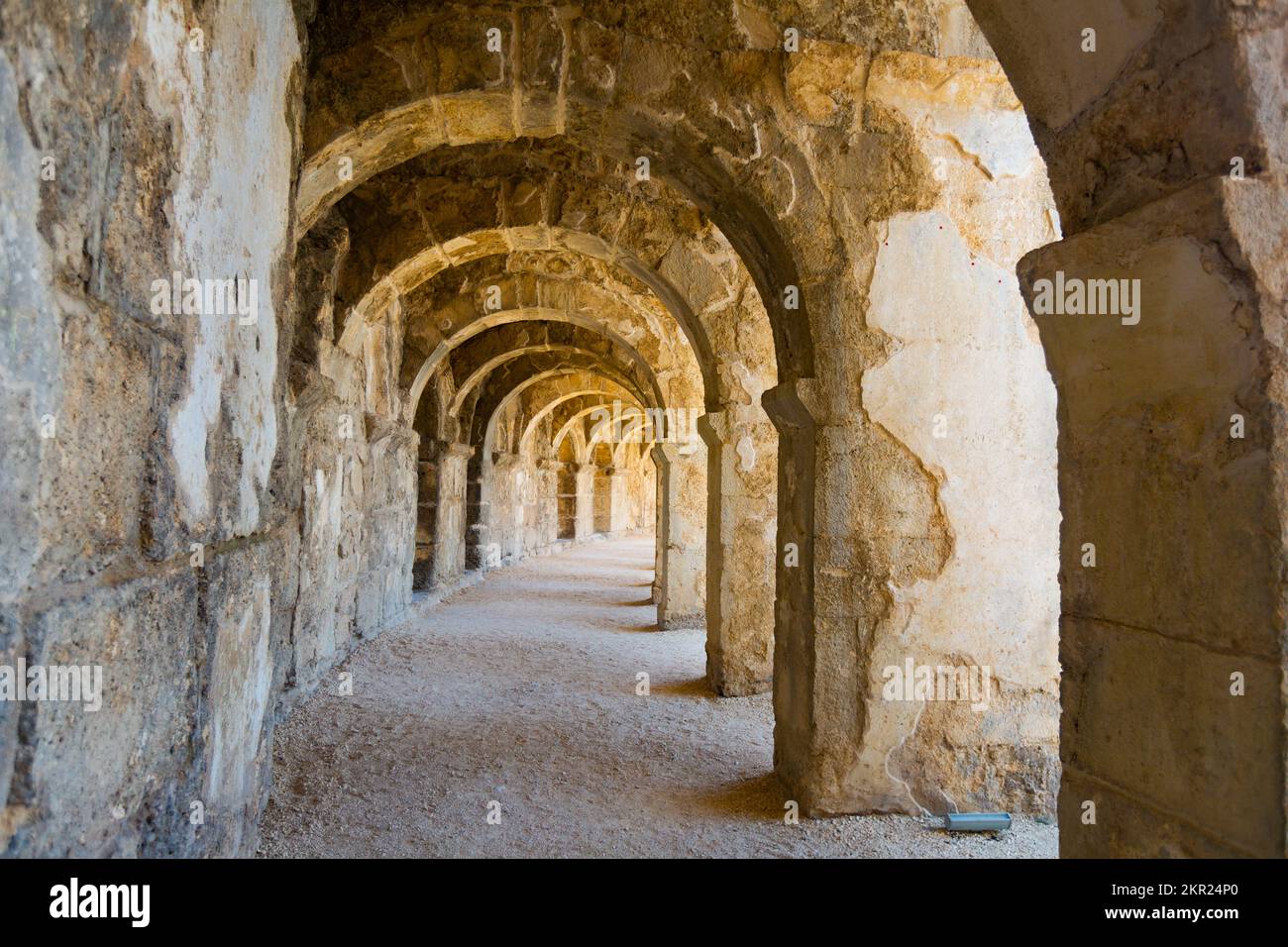 Stone arched gallery of Roman theatre in ancient city of Aspendos ...